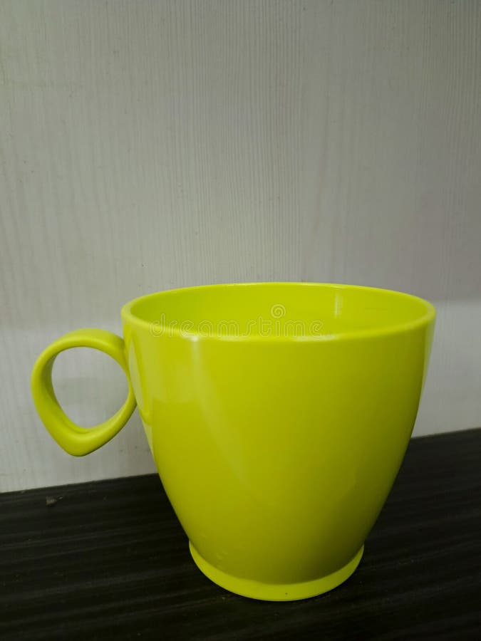 Bright Yellow Plastic Cup Neutral Background Stock Photos - Free ...