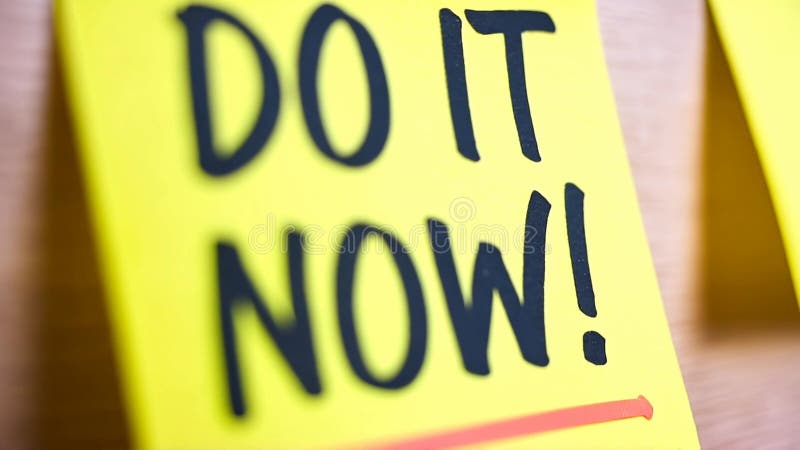 A Bright Yellow Post-it Note with the Words "Do it Now!" Handwritten in ...