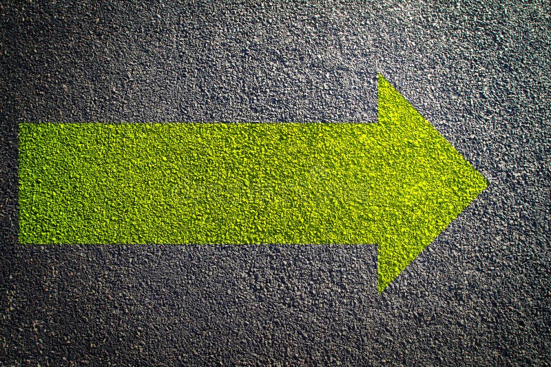 Bright Yellow Right Arrow Painted on Textured Asphalt Road Surface ...
