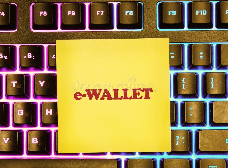 A Bright Yellow Sticky Note Labeled E Wallet is Placed on a Keyboard ...