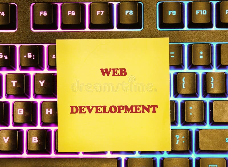 A Bright Yellow Sticky Note Labeled WEB DEVELOPMENT Rests on a Modern ...