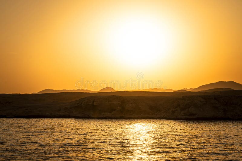 Bright Yellow Sun in the Sky. Beautiful Yellow Sunset on Red Sea Stock ...