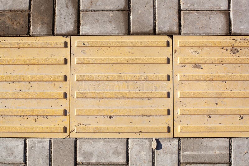 Bright Yellow Tactile Paving for the Visually Impaired Stock Image ...