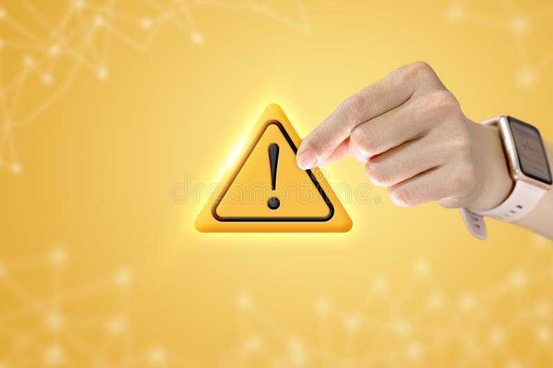 A Bright Yellow Warning Triangle with an Exclamation Mark Being Pointed ...