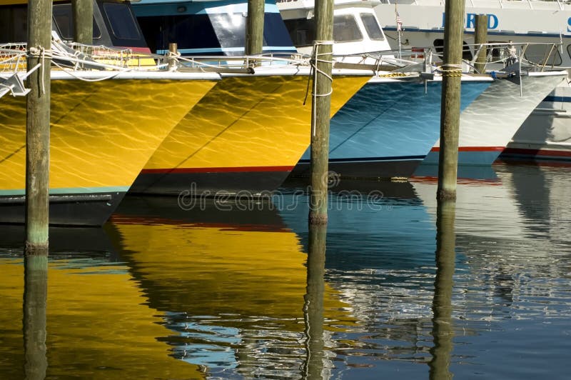 Brightly Colored Boats and Reflections Stock Photo - Image of blue ...