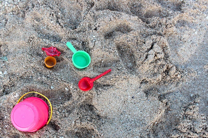 Brightly Colored Children Plastic Toys on Beach Sand Stock Photo ...