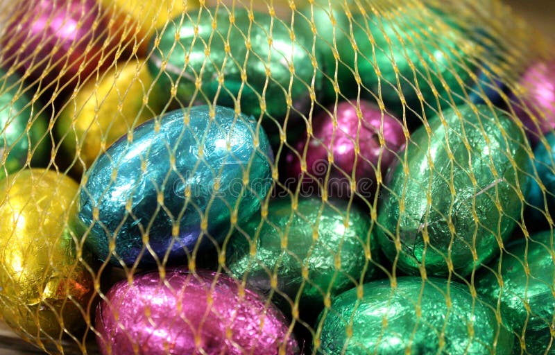 Brightly Colored Chocolate Easter Egg Candies in Mesh Bag Stock Photo ...
