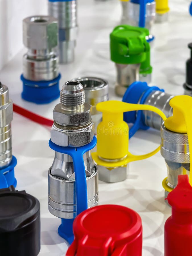 Brightly Colored Industrial Fittings and Connectors Arranged on a Clean ...