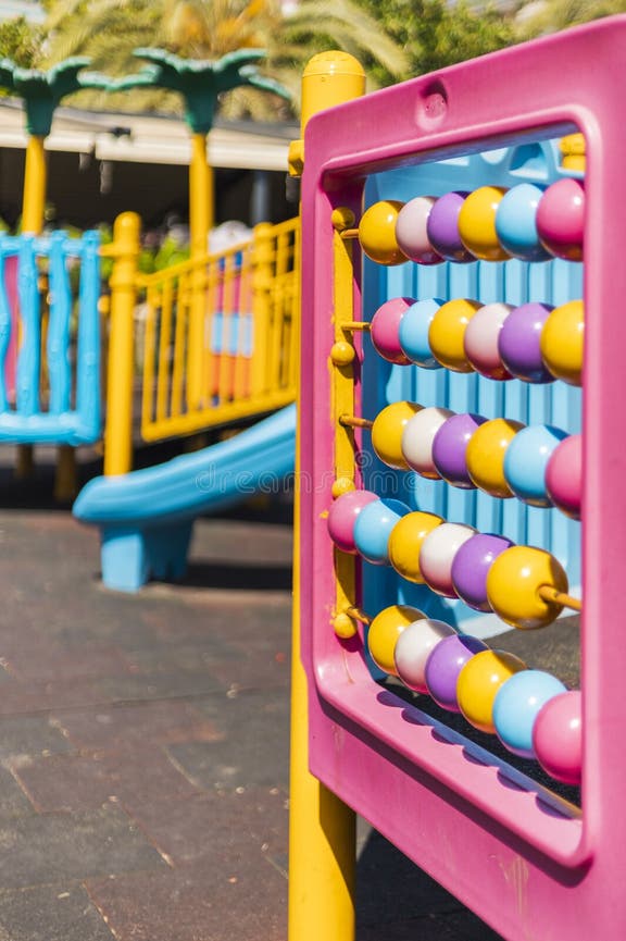 Brightly Colored Playground Features a Climbing Structure and an Abacus ...