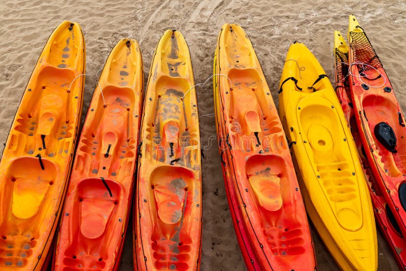 Brightly Coloured Plastic Kayaks Yellow and Red on Sand Beach Coast ...