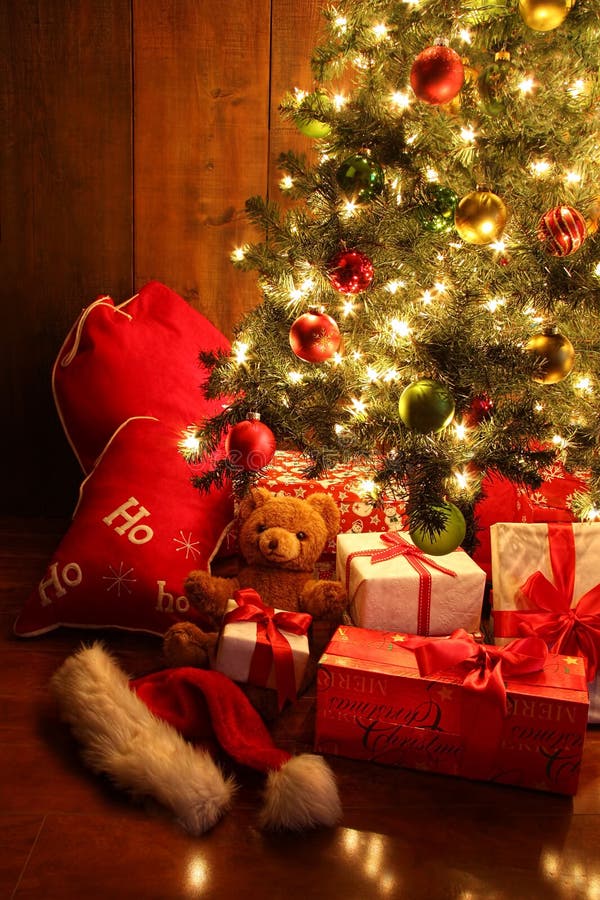 Brightly Lit Christmas Tree with Lots of Gifts Stock Photo - Image of ...