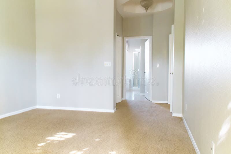 Empty Brightly Lit Empty Carpeted Room with Many Doors Stock Image ...