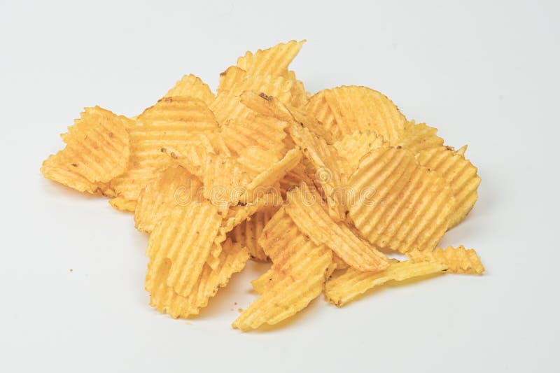 Brightly Lit, Golden-yellow Potato Chips Scattered on a Flat Surface ...