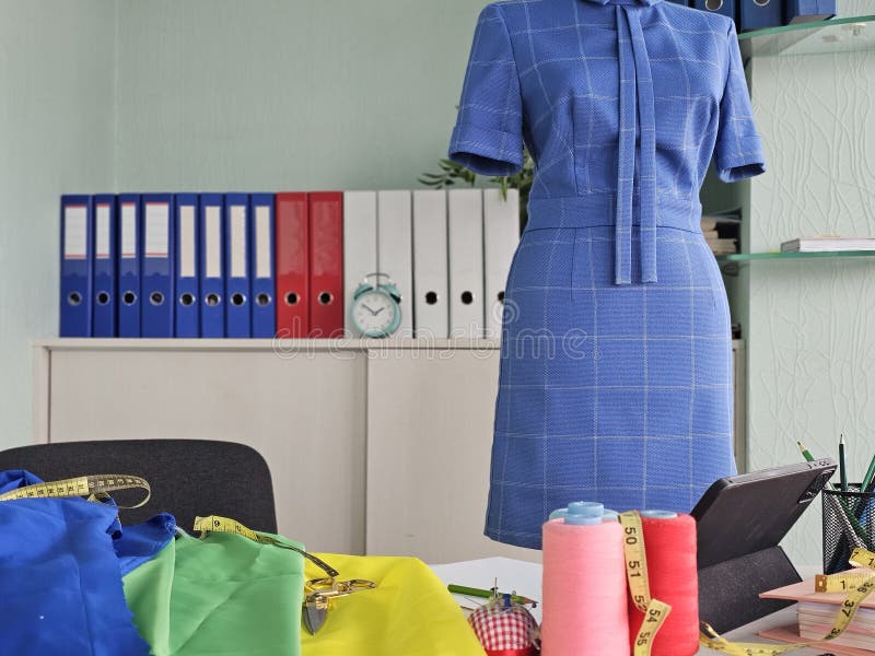 Brightly Lit Tailoring Workspace Featuring Colorful Fabrics and a Blue ...