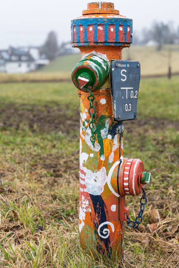 Brightly painted hydrant stock image. Image of washing - 204952515