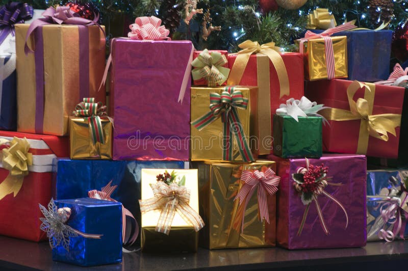 Brightly Wrapped Presents Stacked Under the Christmas Tree Stock Image ...