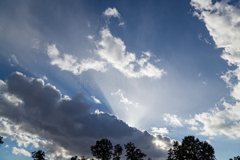 Brilliant Beam of Light in Afternoon Blue Sky with Clouds Stock Photo ...