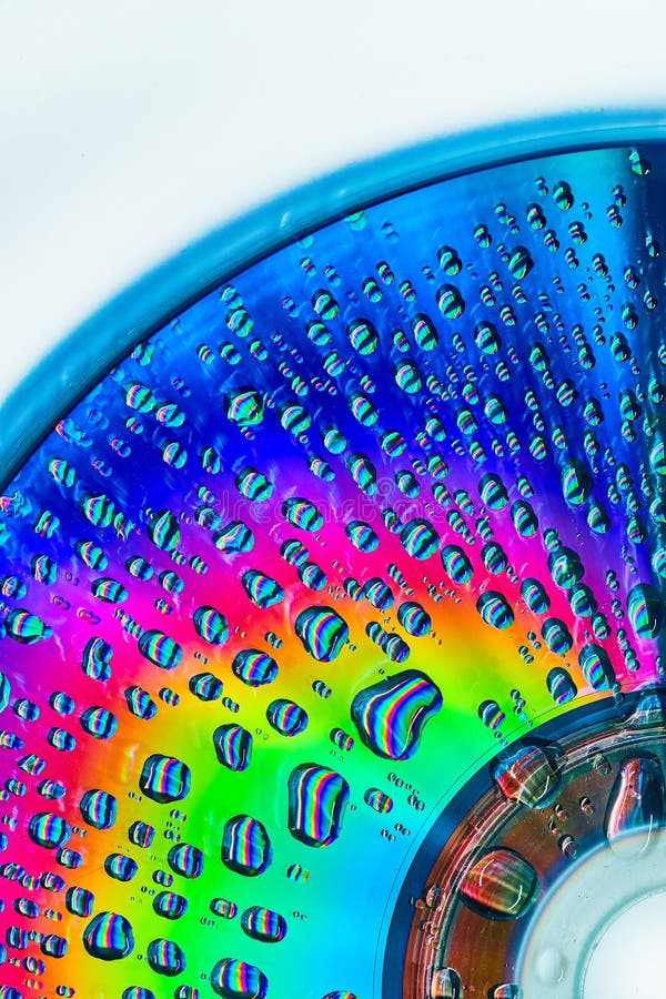 Brilliant Burst of Rainbow Colors on Metallic Surface with Water Drops ...