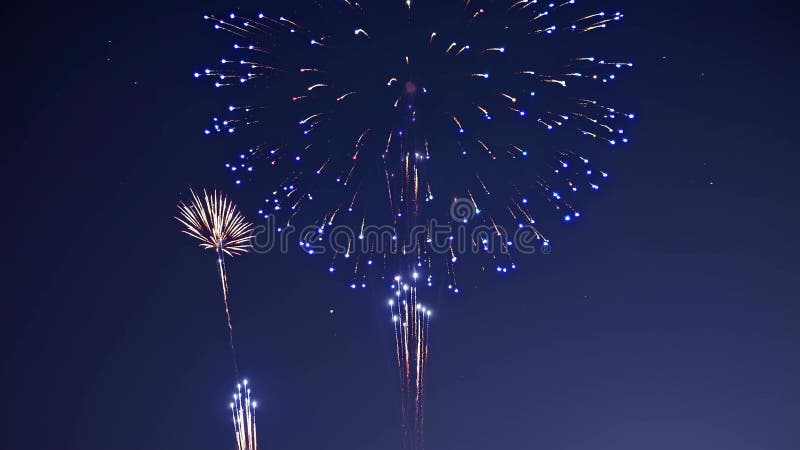 Brilliant Firework Explosion Illuminating Purple Night Sky with Golden ...
