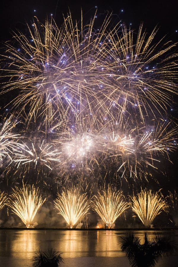 Fireworks Exploding Over the Ocean at Night Stock Photo - Image of ...