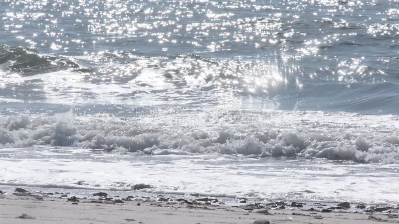 Sparkling Ocean Waves Gently Crashing on the Shore in Portugal Stock ...