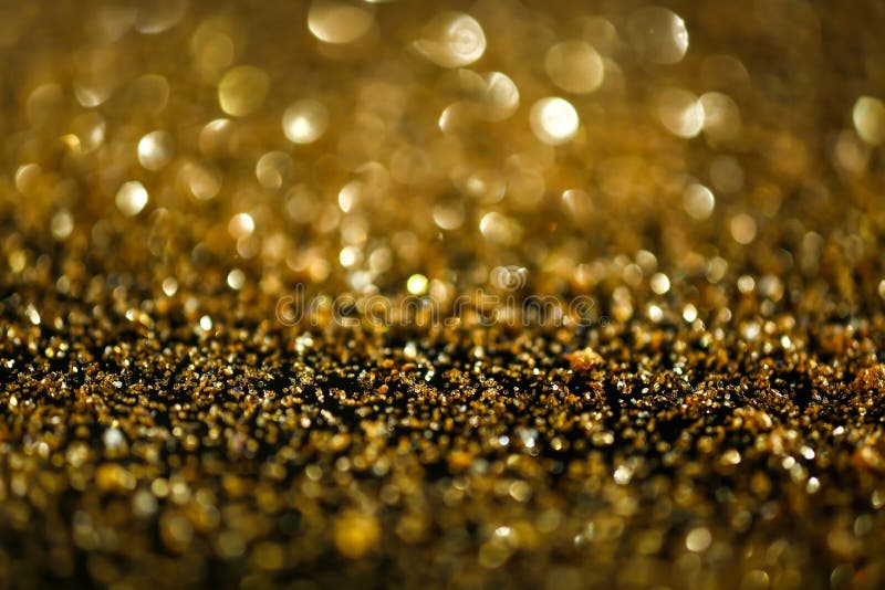 Brillos De Oro En El Fondo Oscuro, Primer Foto de archivo - Imagen de ...