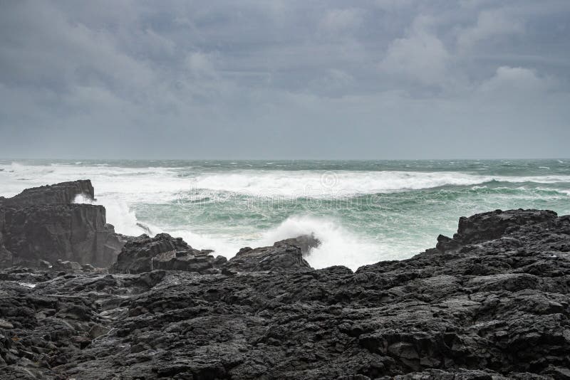 Brimketill Lava Rock Pool in Iceland Storm Waves Hitting Black Basalt ...