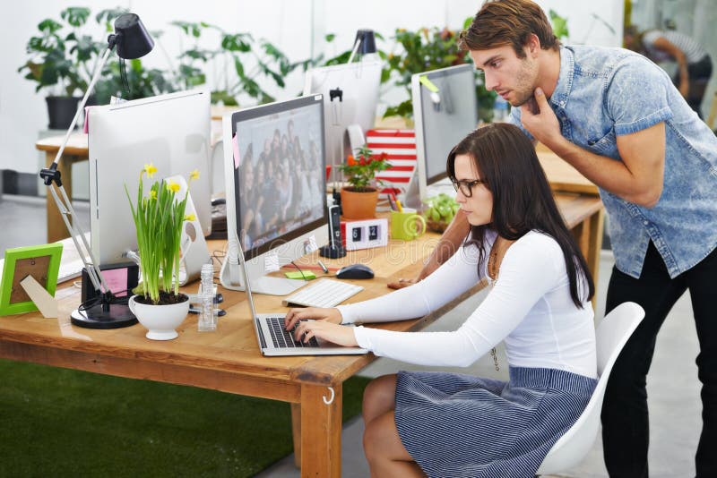 Bringing Ideas into Focus. a Young Designers at Work in an Office ...