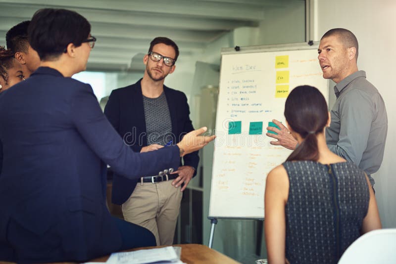 Bringing Up Important Points. a Group of Colleagues Having a Meeting ...