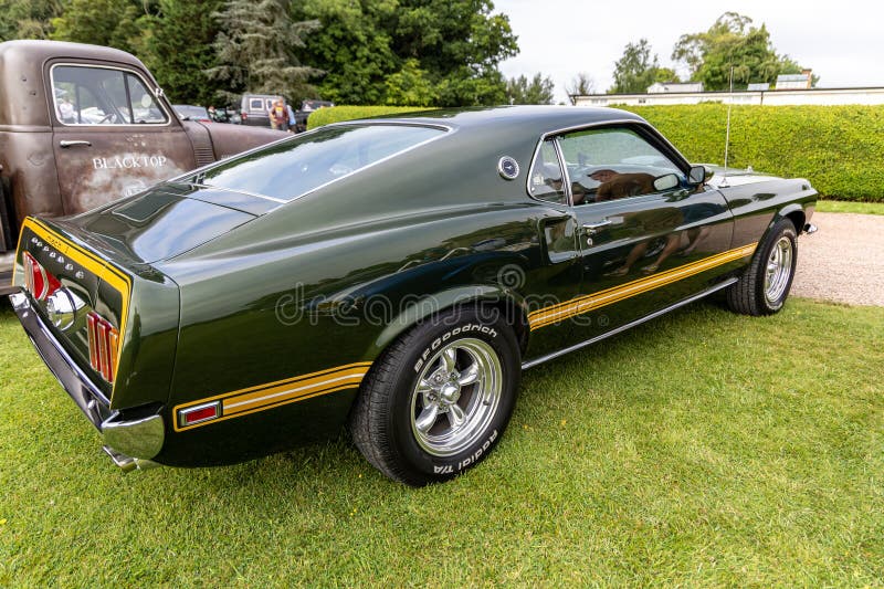 Bristol, UK- August 11, 2024: Side of Dark Green Ford Mustang 1969 Mach ...