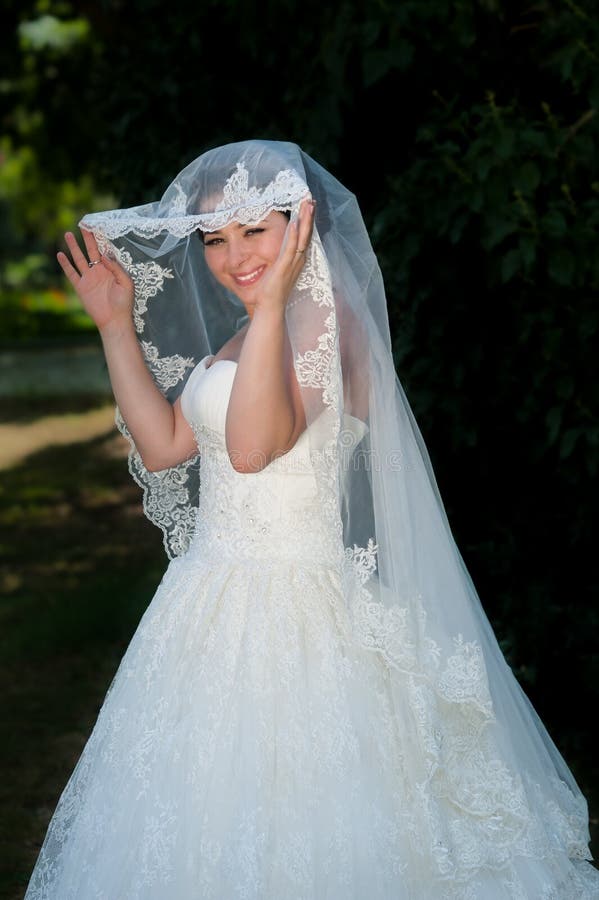 Brite Holding Open Her Bridal Veil with Two Hands Stock Photo - Image ...