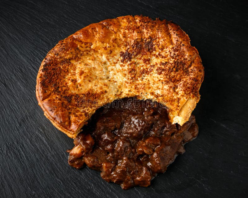 British Beef Steak Pie with Onion, Wine Gravy on Rustic Stone Board ...