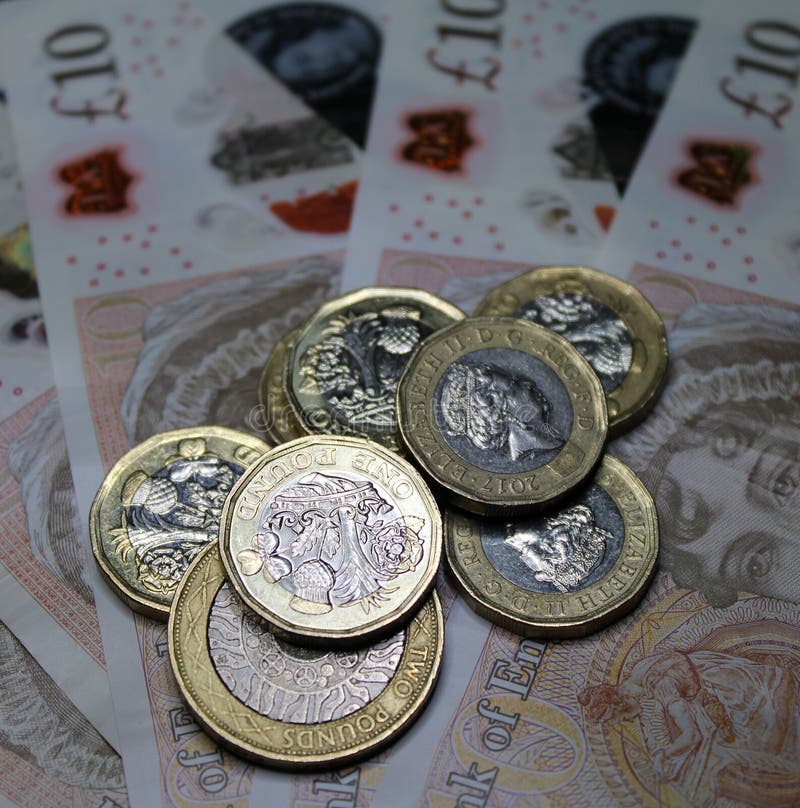 British Currency As One and Two Pound Coins and Ten Pound Notes Stock ...
