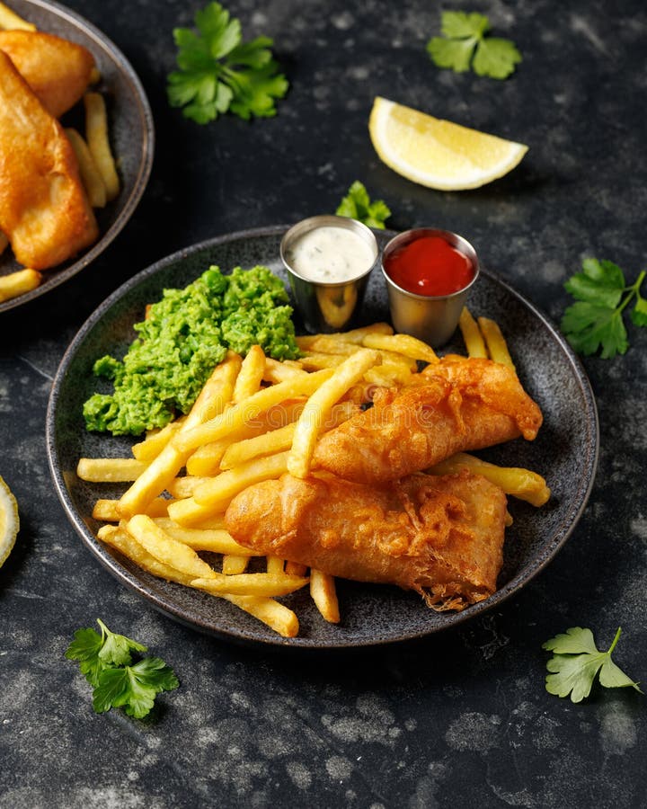 British Fish and Chips with Mashed Peas, Tartar and Ketchup Sauce ...