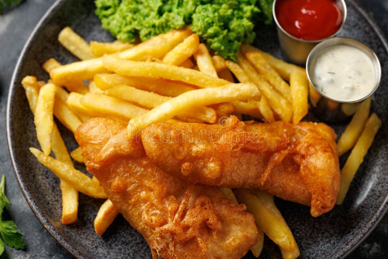British Fish and Chips with Mashed Peas, Tartar and Ketchup Sauce ...
