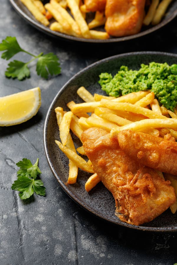 British Fish and Chips with Mashed Peas, Tartar and Ketchup Sauce ...