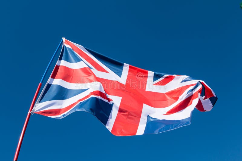 British Flag on blue sky stock image. Image of flags - 79335073