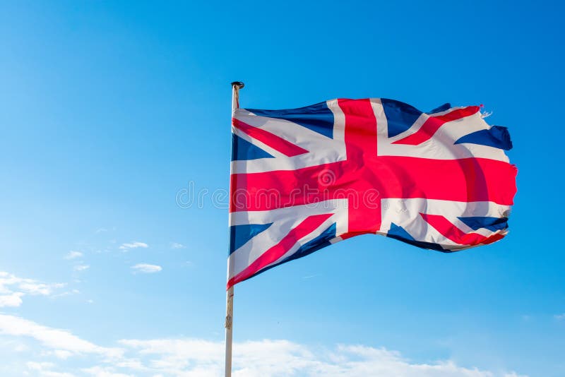 British Flag Waving Against Blue Sky Stock Photo - Image of destination ...
