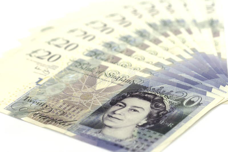 British Pounds Sterling Coins Up Close on a Wooden Background Stock ...