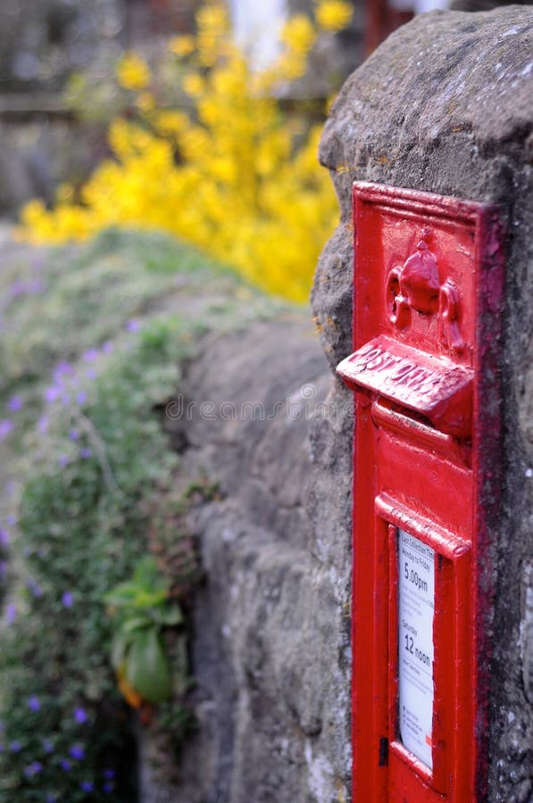 British Red Post Box in Wall Stock Photo - Image of flowers, mail: 23374278