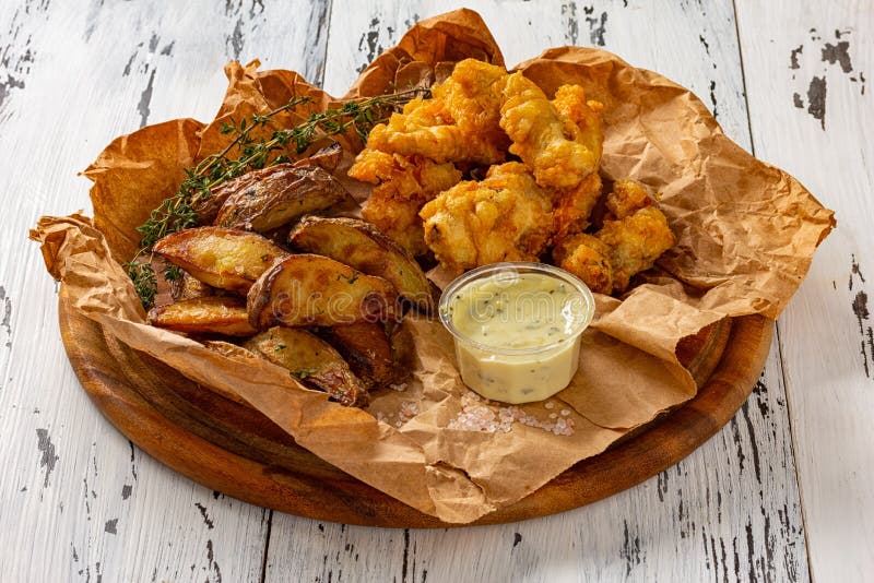 Fish and Chips Served on Crumpled Paper. Stock Image - Image of ...