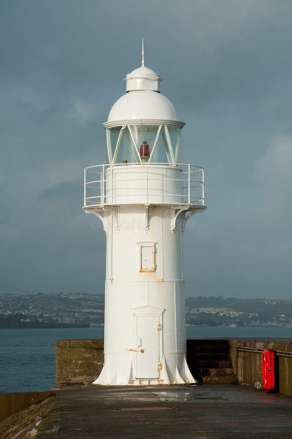 Brixham Lighthouse stock photo. Image of beam, white - 12199330