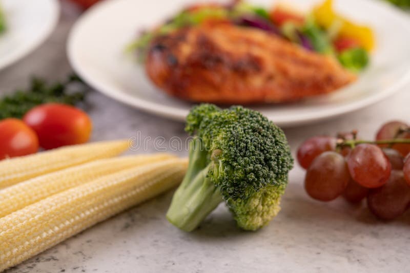 Broccoli, Baby Corn, Grapes and Tomatoes on White Stock Photo - Image ...