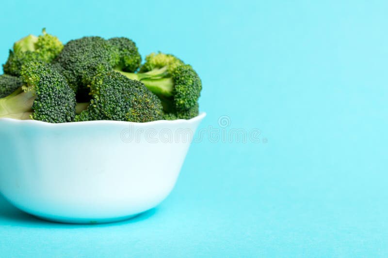 Broccoli of Fresh Green Broccoli in Bowl Over Coloredbackground ...