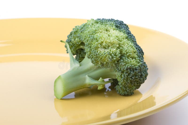 Broccoli on a plate stock image. Image of healthy, yellow - 7603359