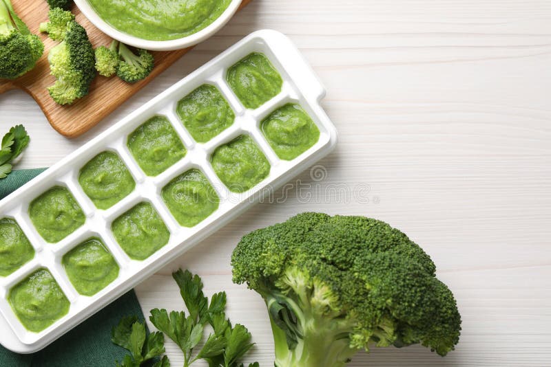 Broccoli Puree in Ice Cube Tray Ready for Freezing and Ingredients on ...