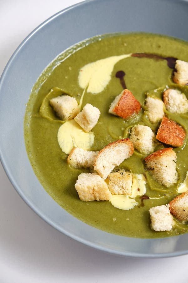 Broccoli Puree Soup with Cream and Balsamic Sauce and a Plate with ...