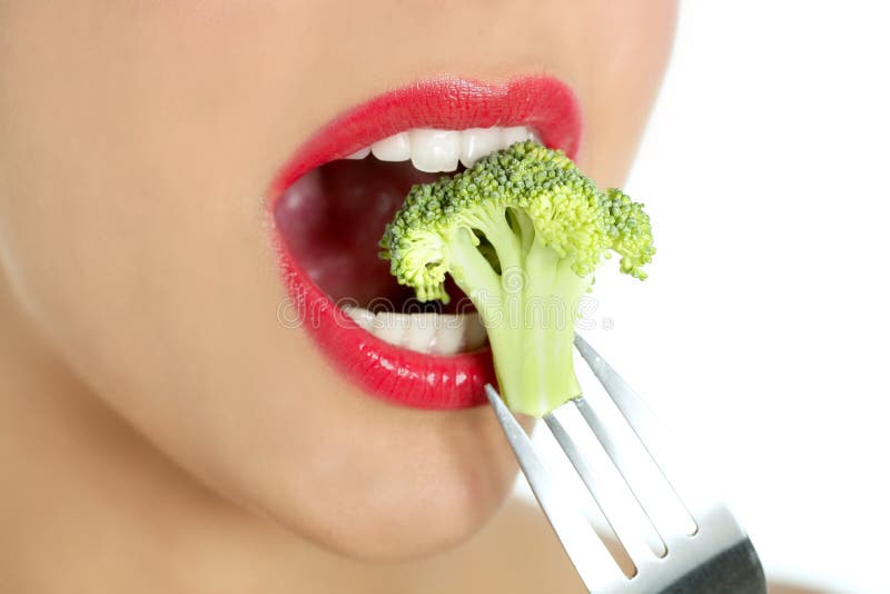Broccoli on Steel Fork in Woman Mouth Stock Photo - Image of fresh ...