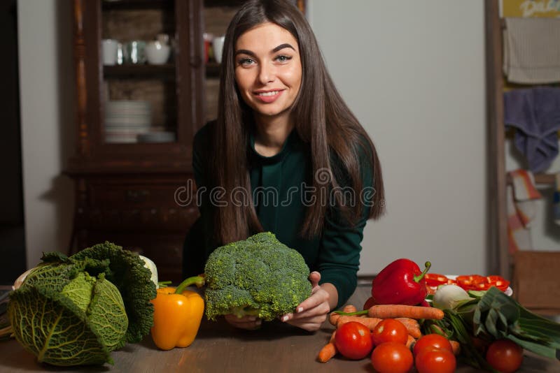 Broccoli and woman stock photo. Image of carrot, indoors - 82957534