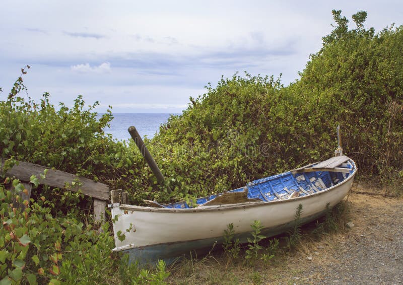Broken and Abandoned Row-boat by the Ocean. Stock Photo - Image of ...